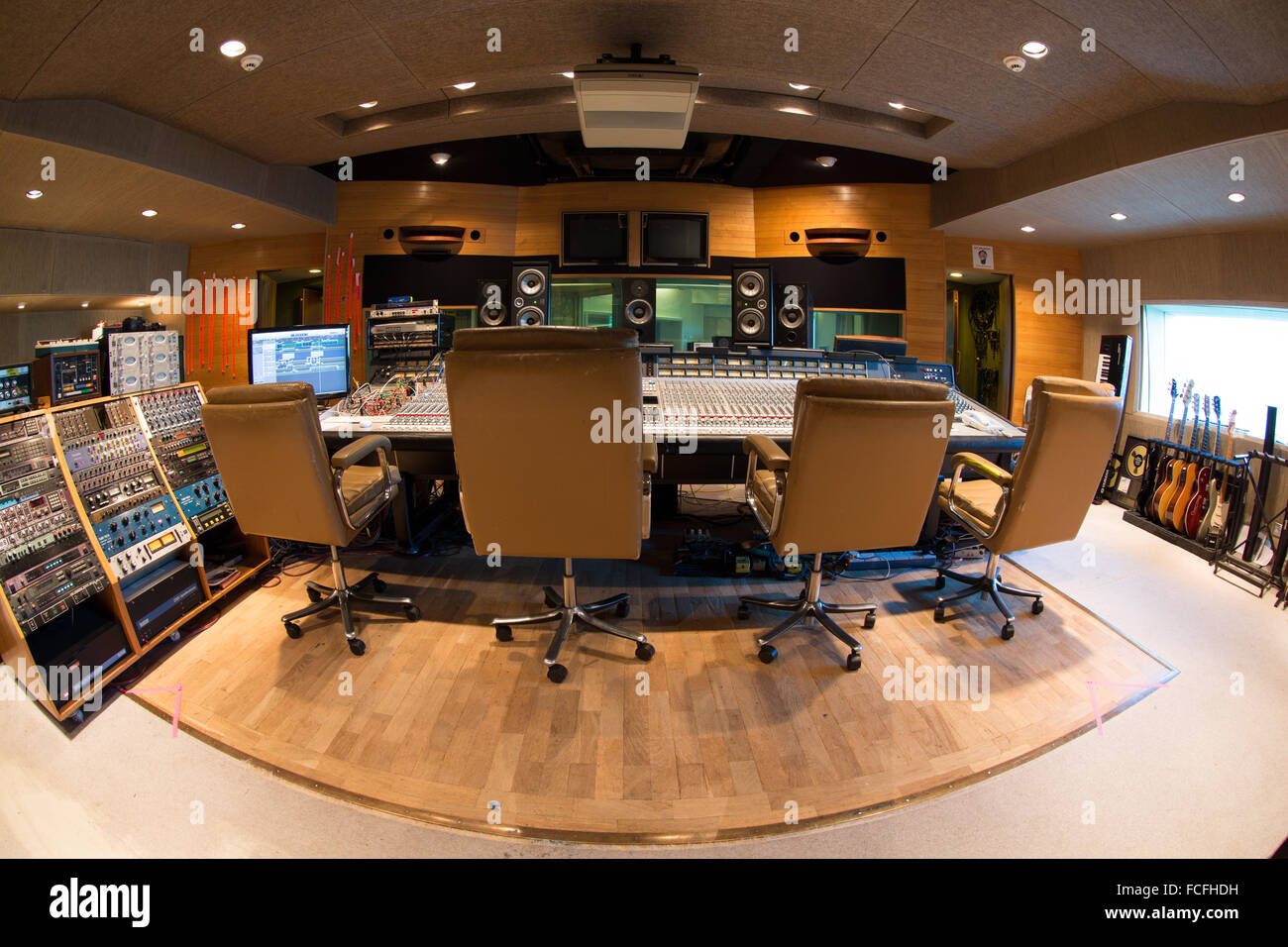 side view of ssl e series sound mixing desk with focal professional ...