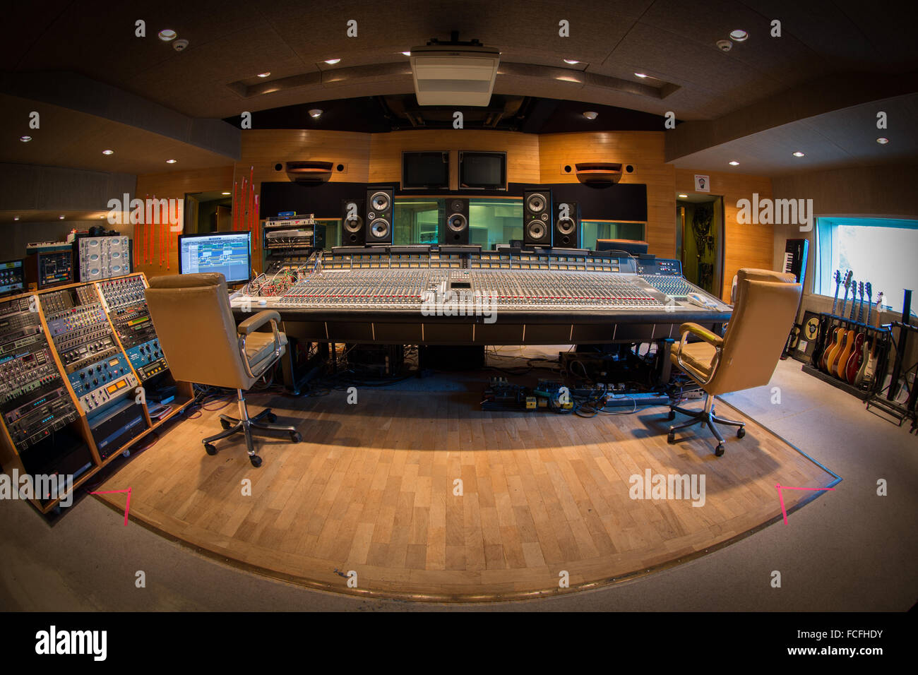 side view of ssl e series sound mixing desk with focal professional ...