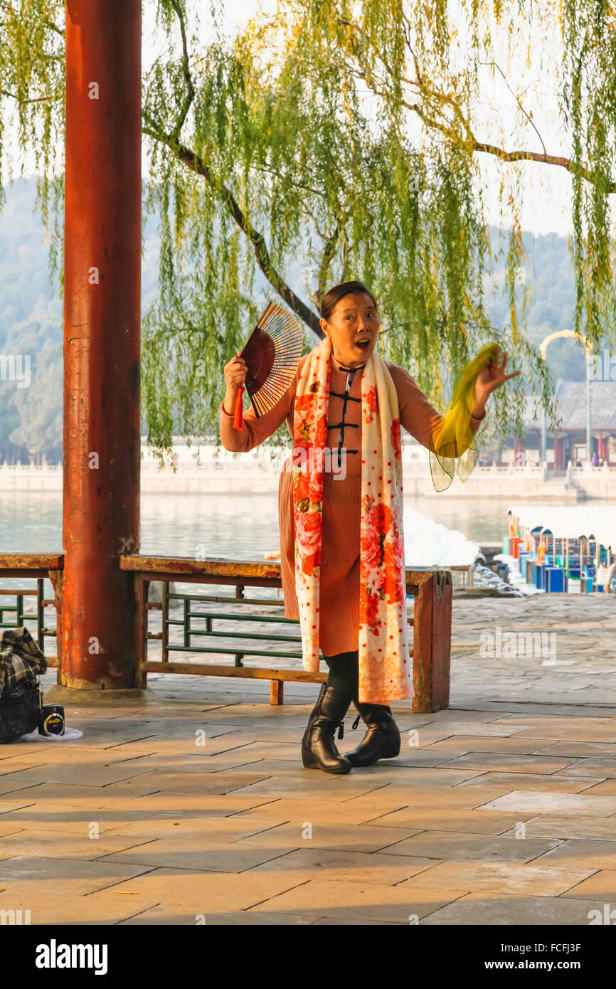 Chinese Lady performing in traditional dress at the lake at the Summer ...