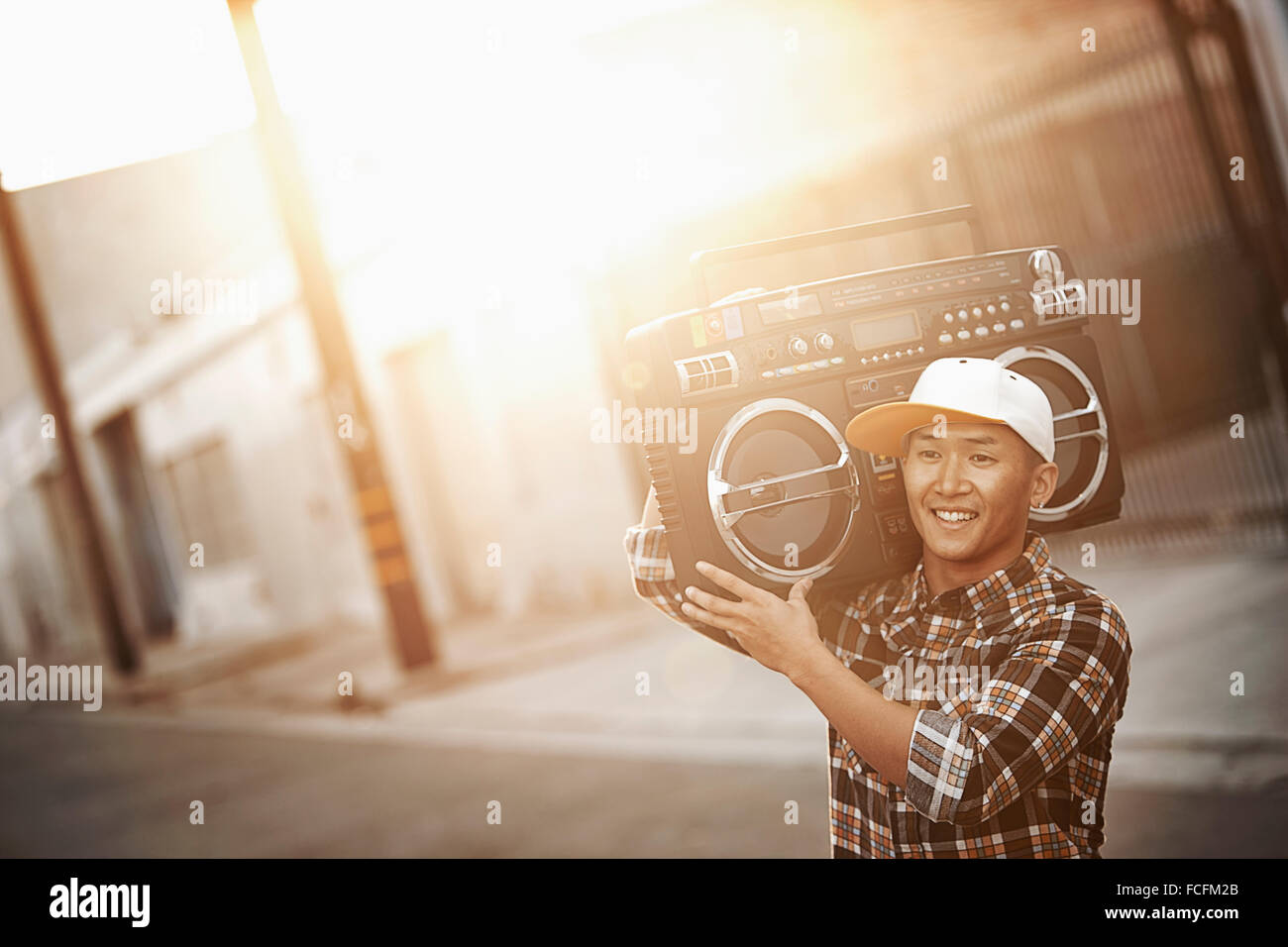 Young man boombox on shoulder hi-res stock photography and images - Alamy