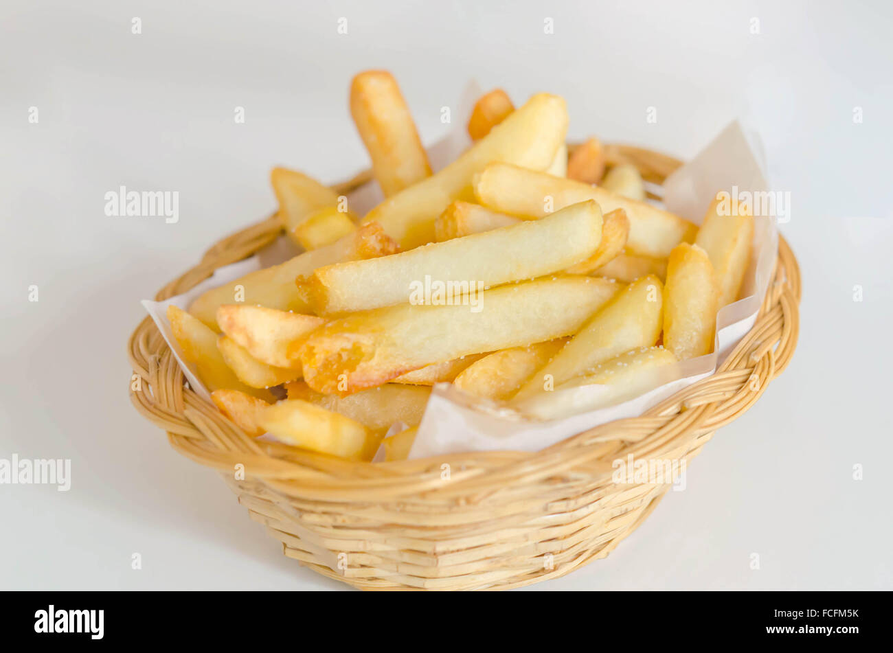 Traditional French fries in a bamboo basket Stock Photo - Alamy