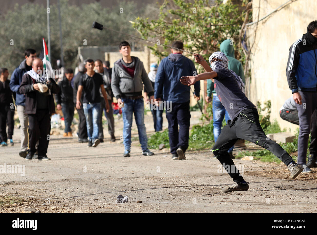 Nablus. 22nd Jan, 2016. A Palestinian protester uses slingshot to throw ...