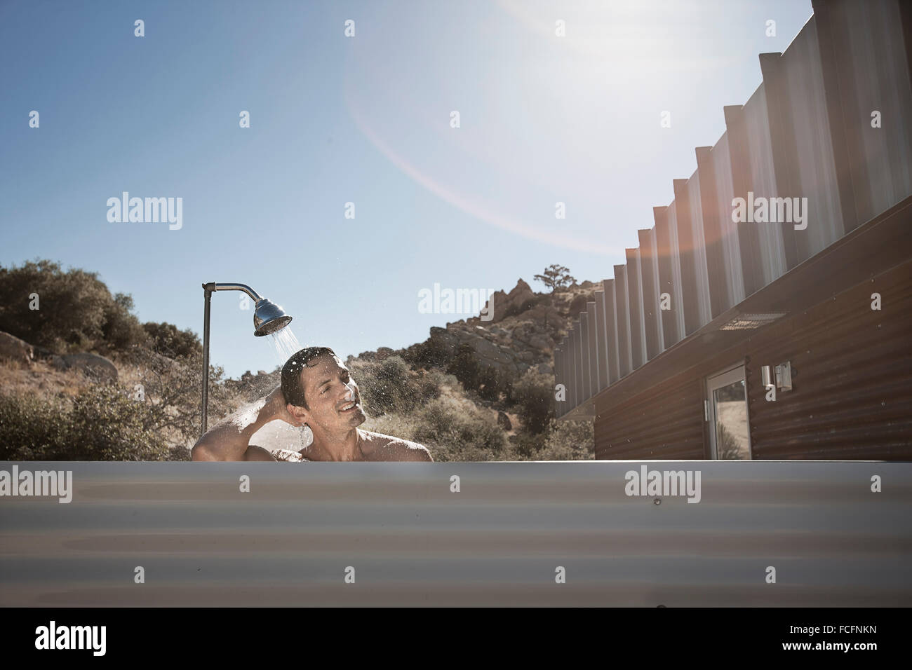Man taking outdoor shower hi-res stock photography and images - Alamy
