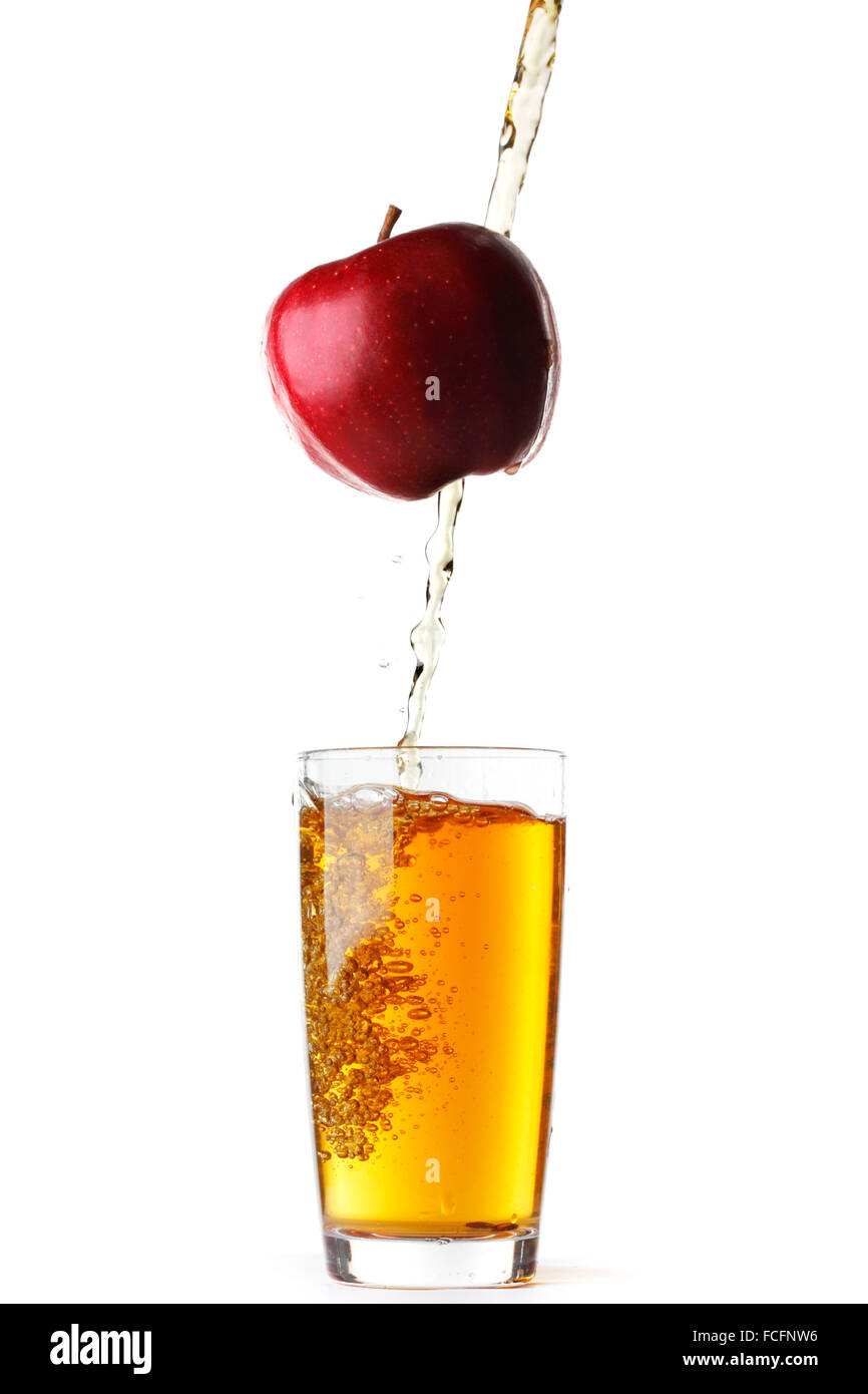 Juice pouring from apple into glass isolated on white background Stock ...