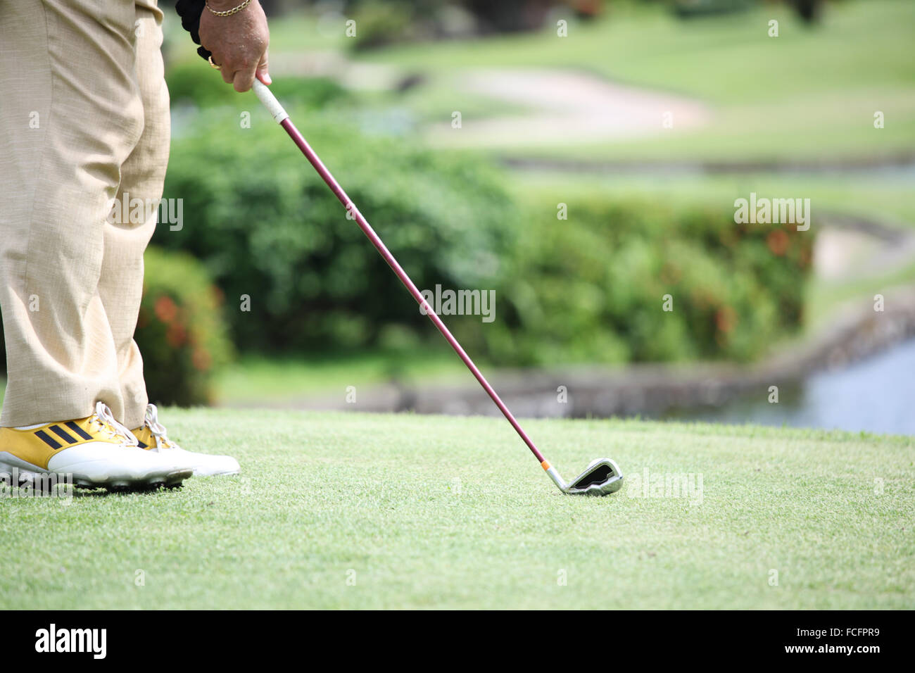 Golfer swinging on golf course hi-res stock photography and images - Alamy