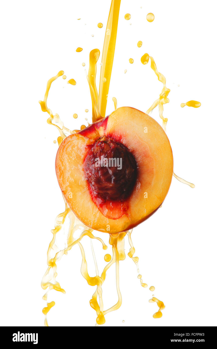 Peach juice splashing isolated on white background Stock Photo - Alamy