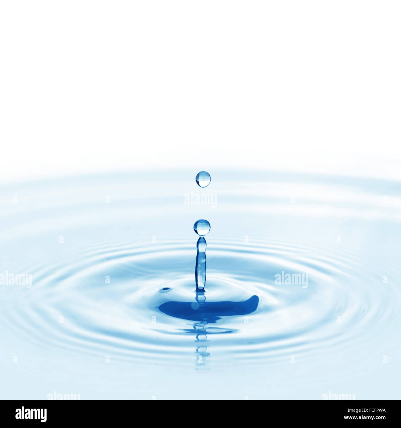Water drop falling into water making a perfect droplet splash Stock Photo - Alamy