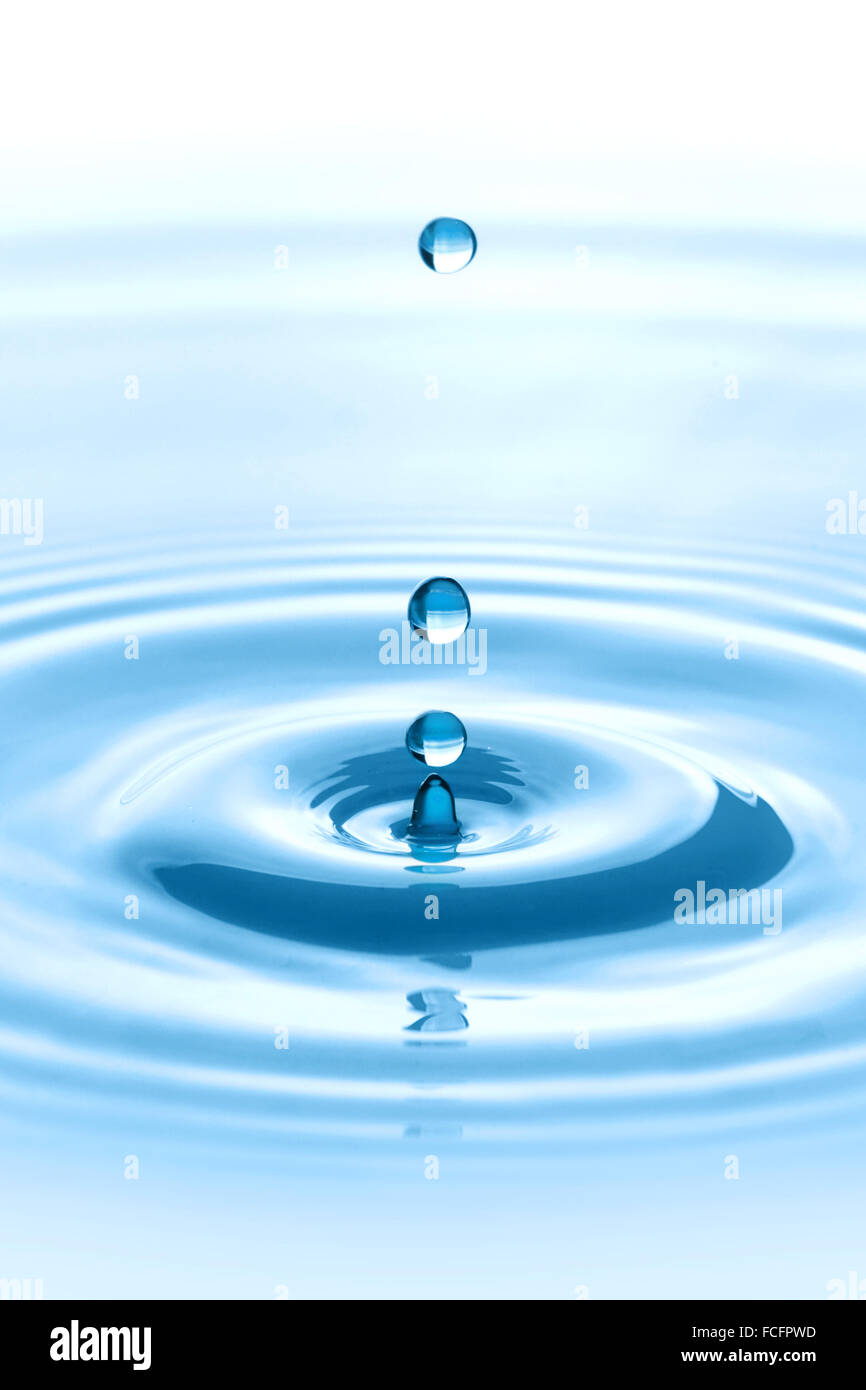 Water drop falling into water making a perfect droplet splash Stock Photo - Alamy