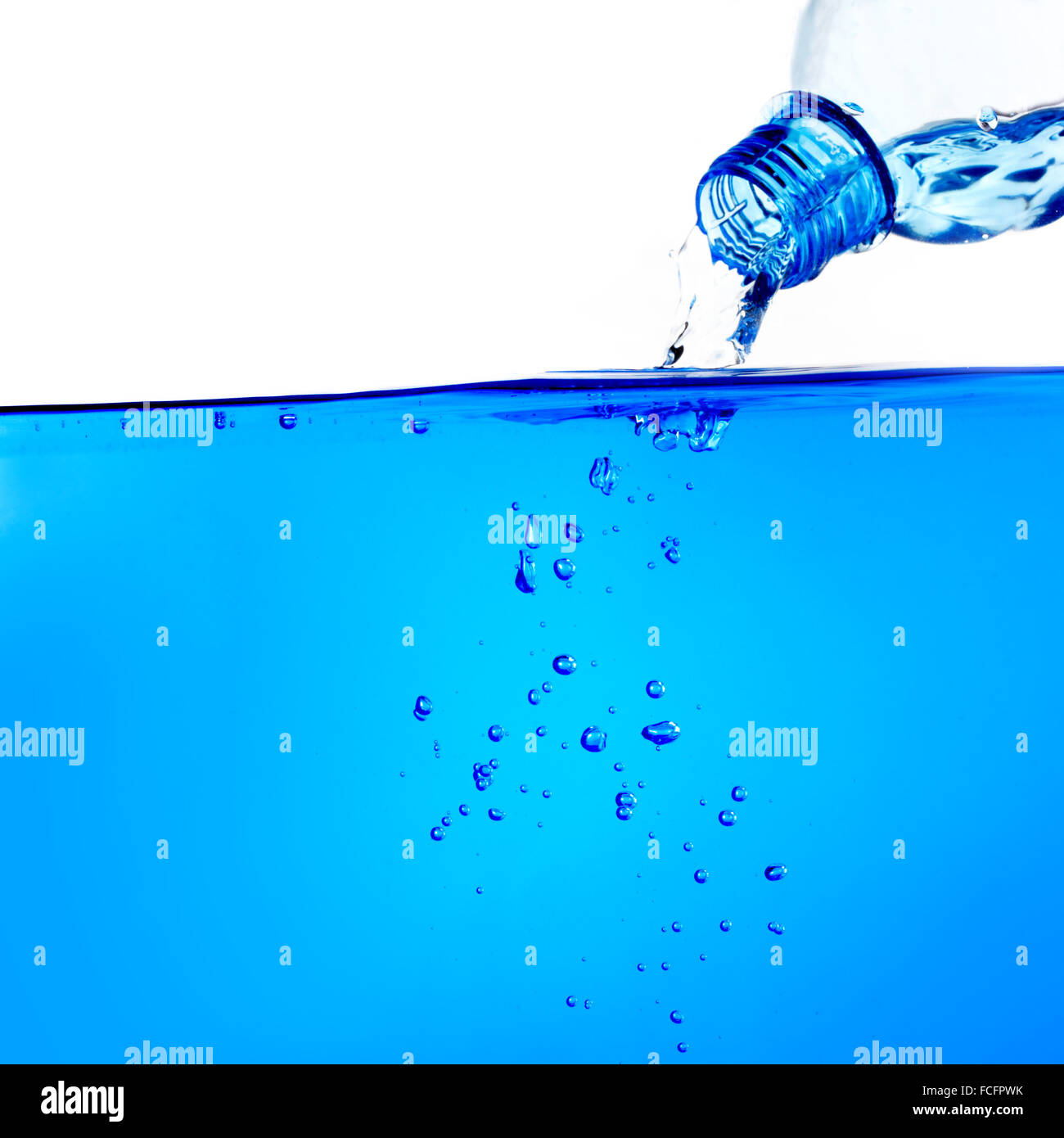 Water from water bottle with bubble forming Stock Photo - Alamy