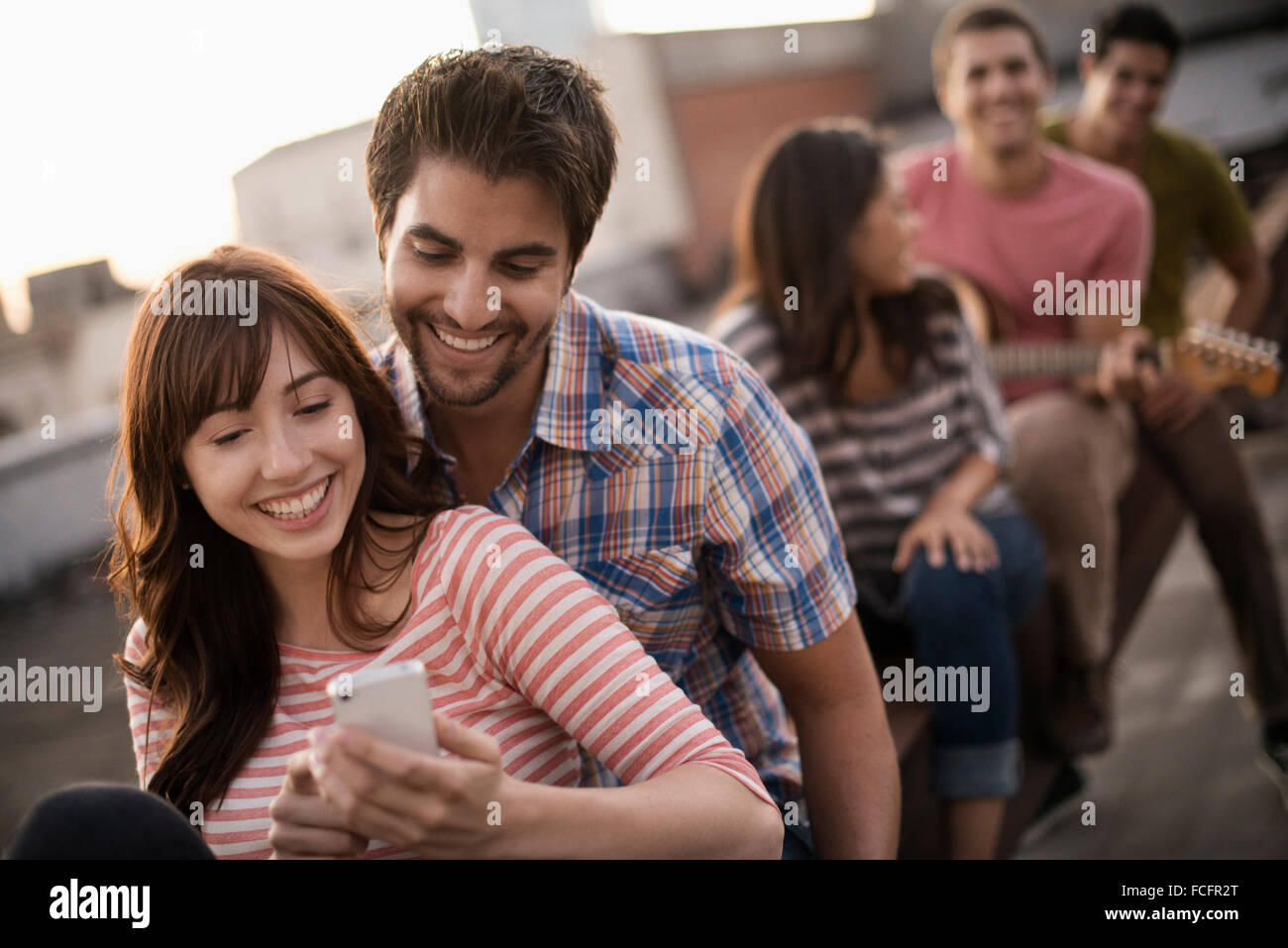 A group of people, men and women gathered together Stock Photo - Alamy