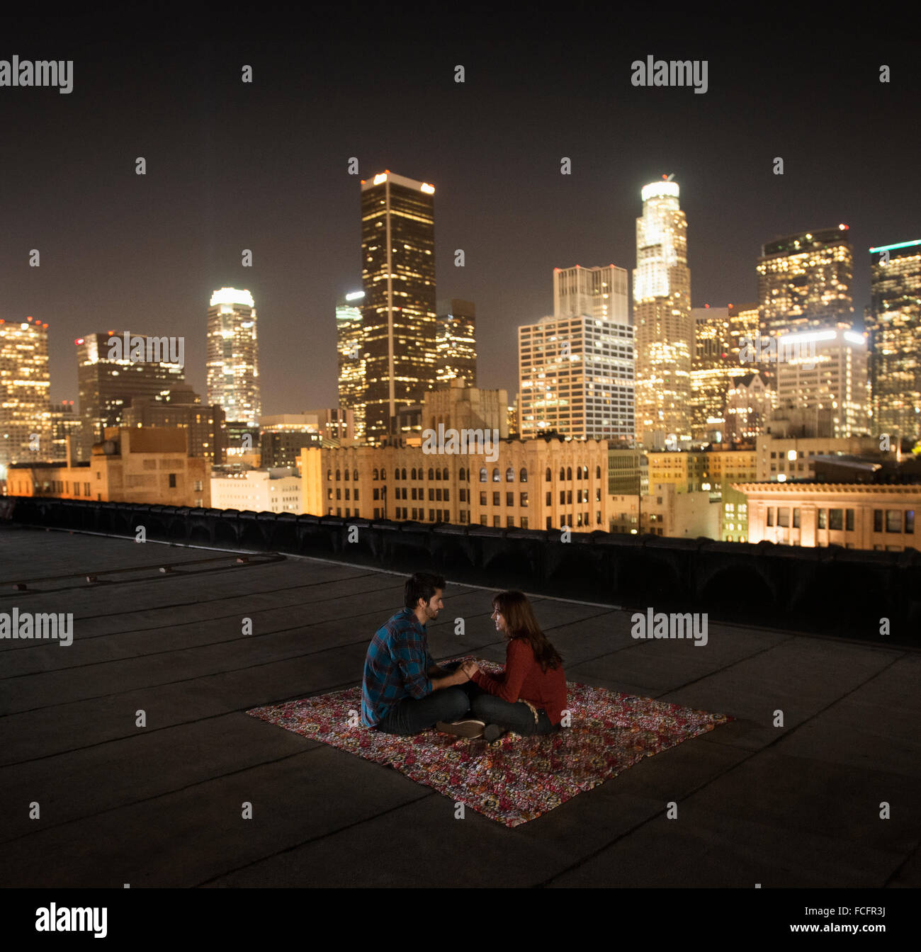 Couple rooftop city night hi-res stock photography and images - Alamy
