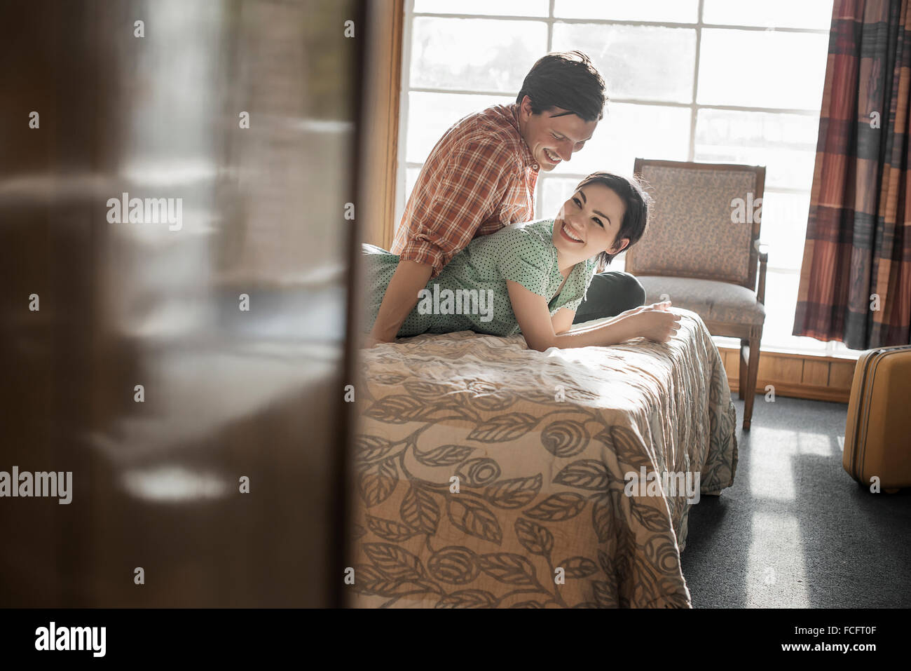 A young couple in a motel room Stock Photo - Alamy