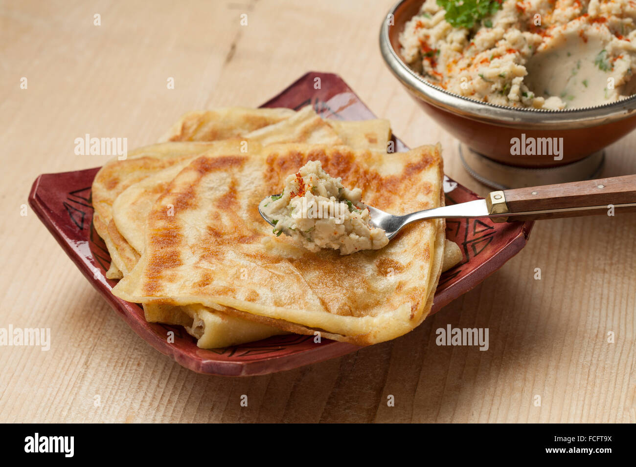 Msemen with a spoonful moroccan bessara Stock Photo - Alamy
