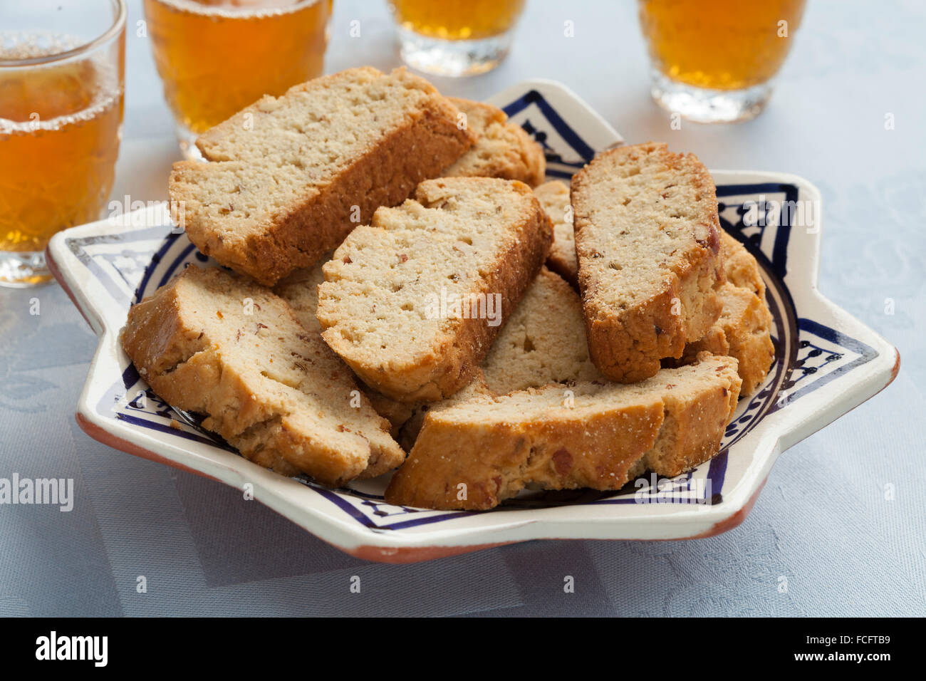 Dish with traditional Moroccan fekkas cookies with tea Stock Photo - Alamy
