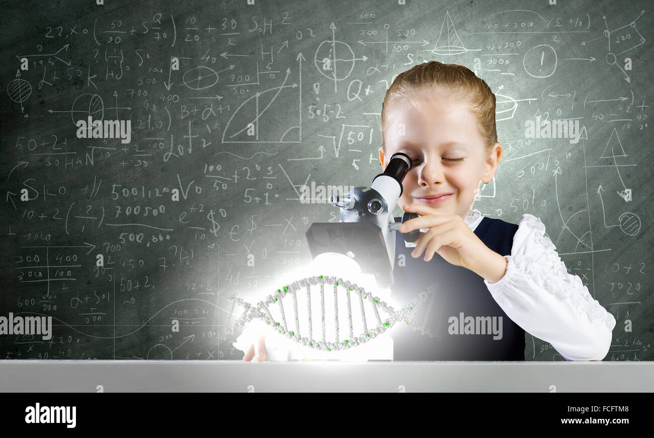 Cute school girl examining dna molecule with microscope Stock Photo - Alamy