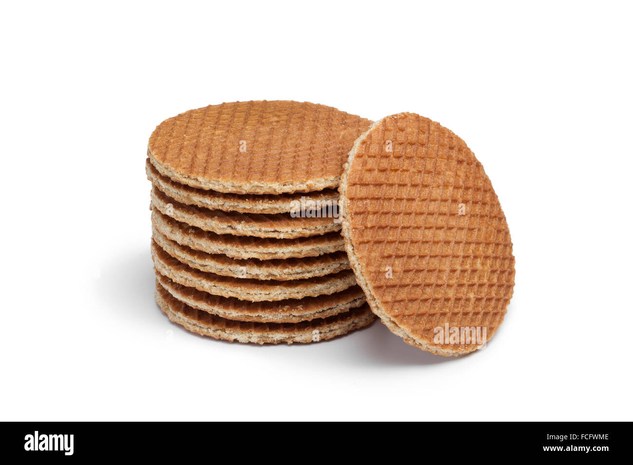 Heap of fresh baked Dutch syrup waffles on white background Stock Photo ...