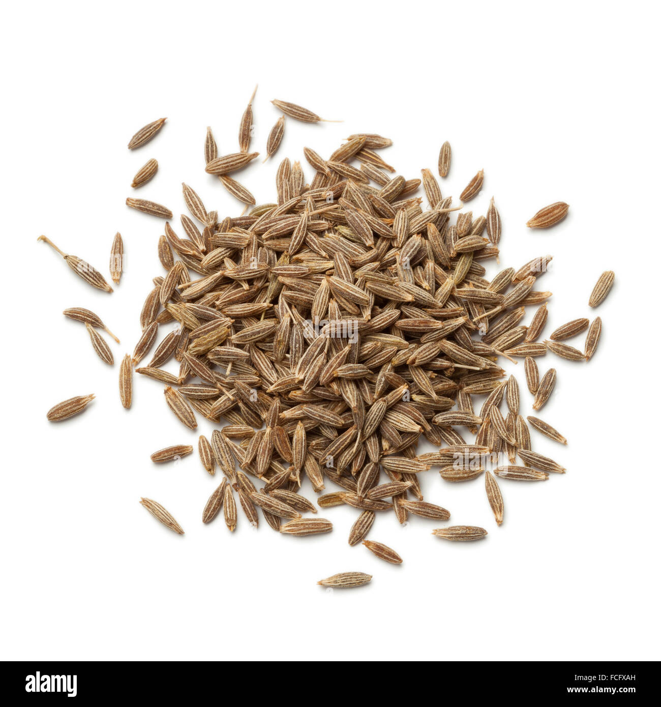 Heap of dried cumin seeds on white background Stock Photo - Alamy