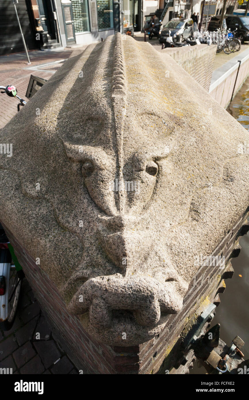 Reptile alligator / crocodile ? stone sculpture. Canal bridge ...