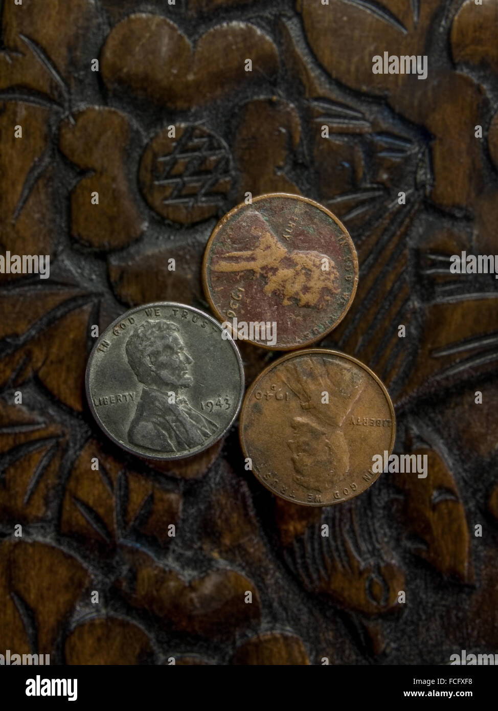 Three old American pennies side by side from the years 1943, 1940, 1936 ...