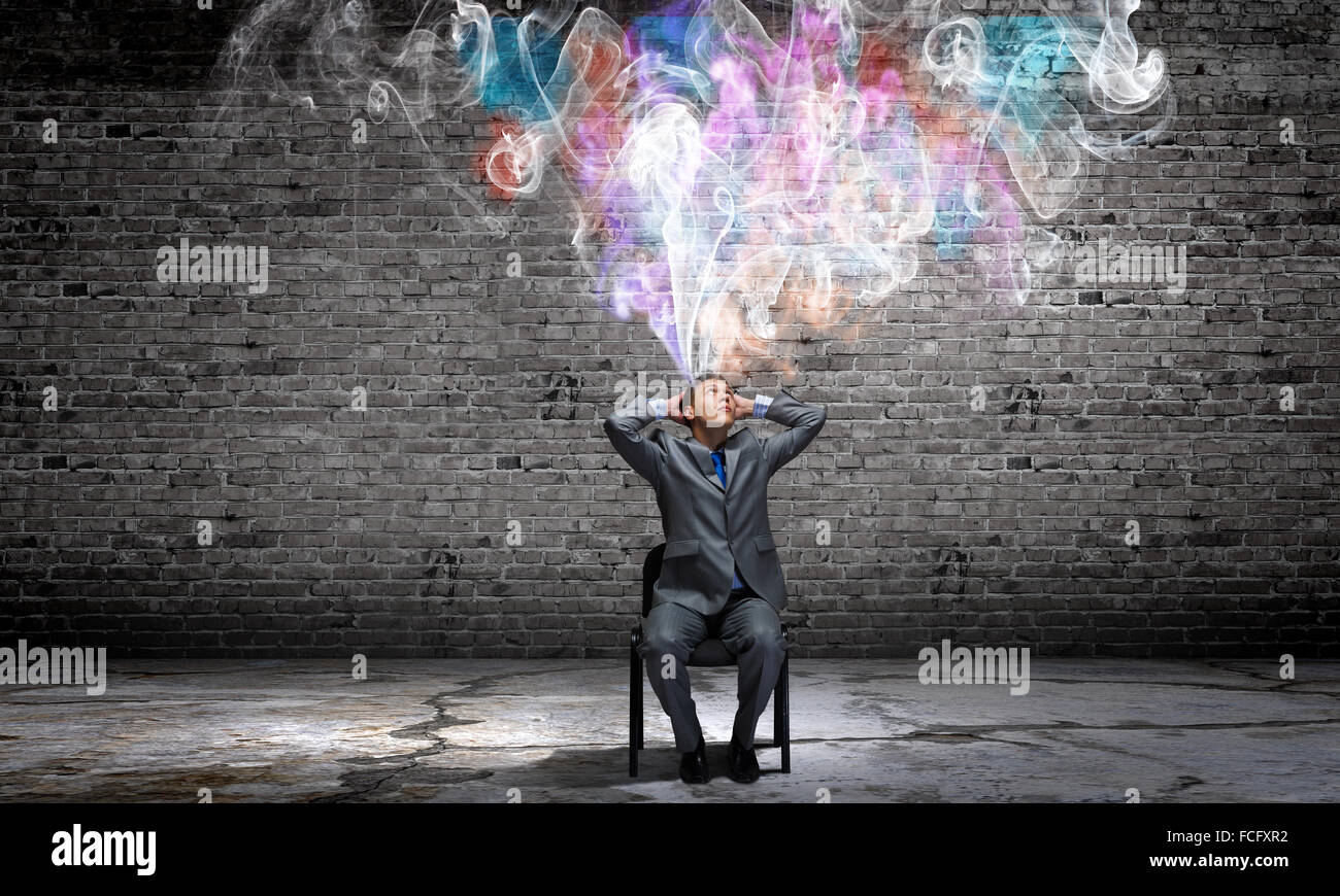 Young businessman thinking over the ideas. Creativity concept Stock ...