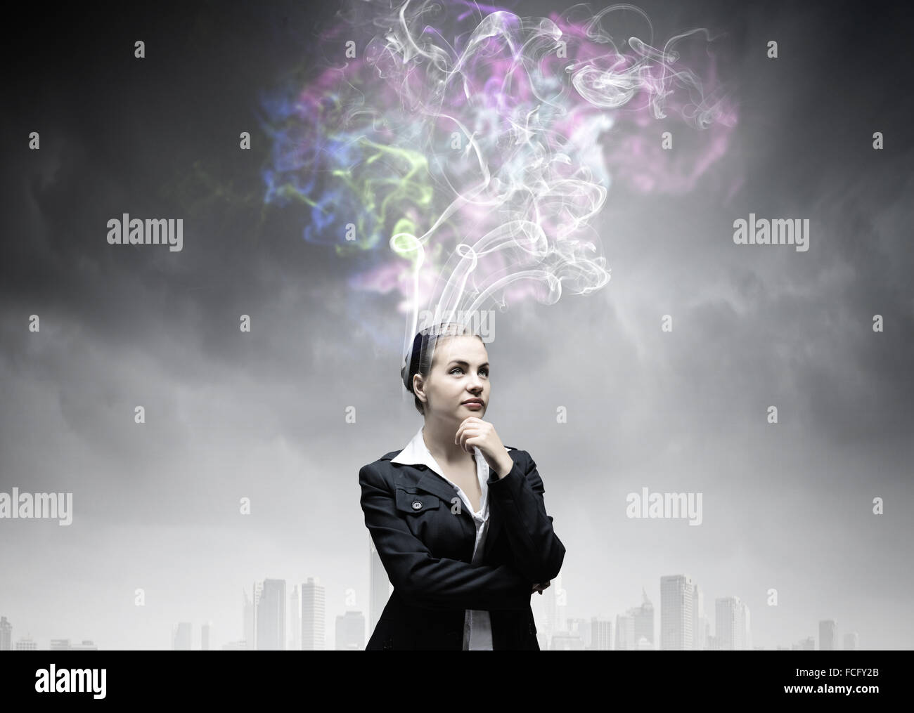 Young pretty businesswoman thinking over the ideas. Creativity concept ...