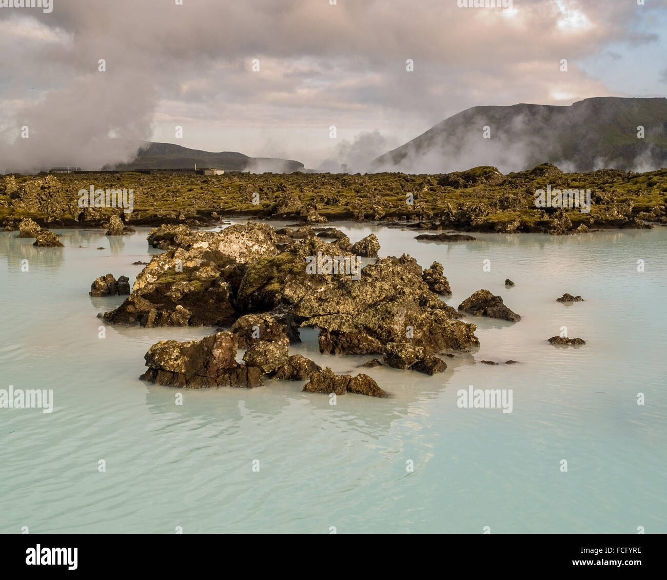 Silica rich blue green water outside of the Blue Lagoon Spa in a lava ...