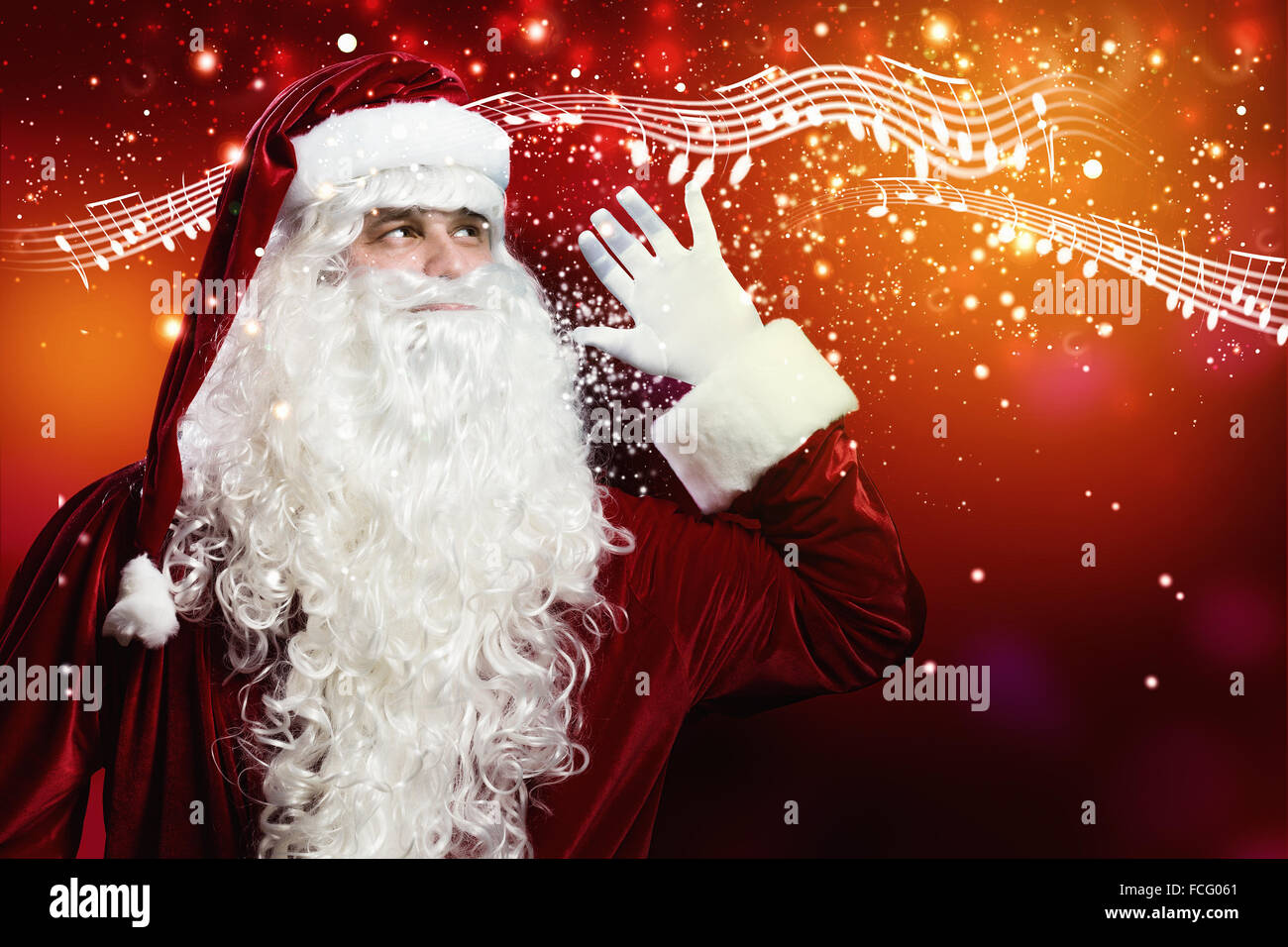 Santa Claus enjoying the sound of music Stock Photo - Alamy