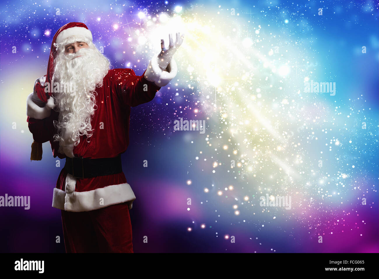 Santa Clause with gift bag behind shoulders Stock Photo - Alamy