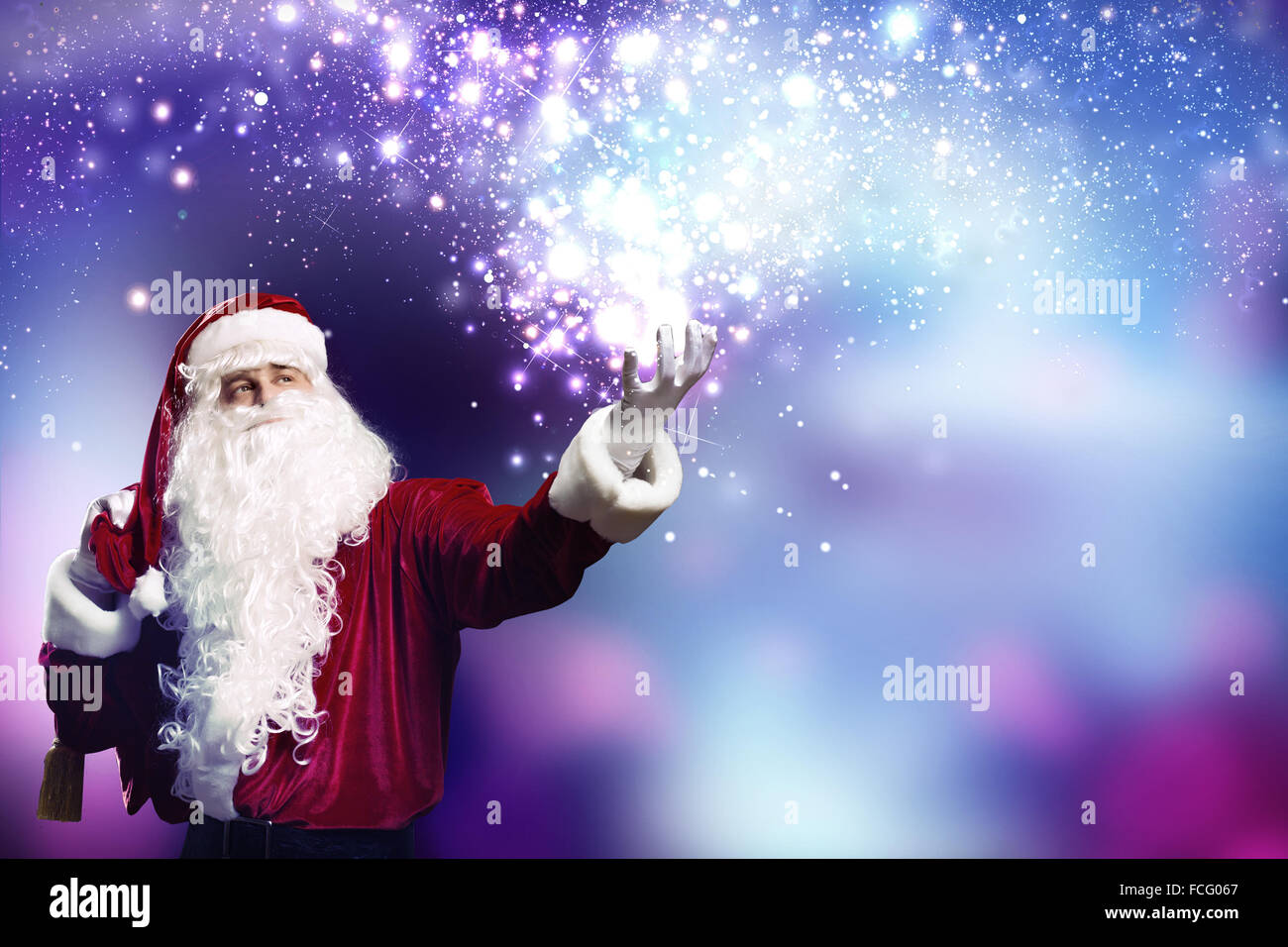 Santa Clause with gift bag behind shoulders Stock Photo - Alamy
