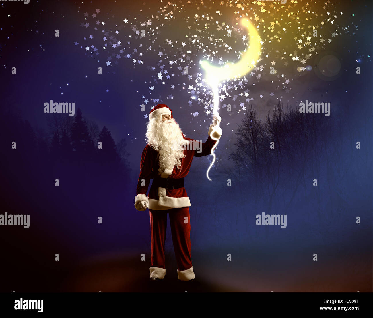 Santa Clause in red costume against blue background Stock Photo - Alamy