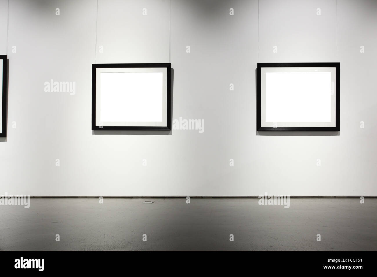 Exhibition hall with empty frames on wall Stock Photo - Alamy