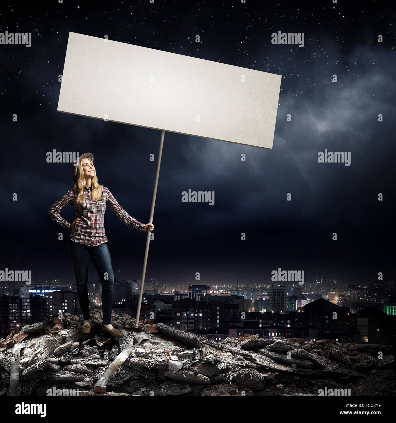 Young woman in casual carrying white blank banner Stock Photo - Alamy