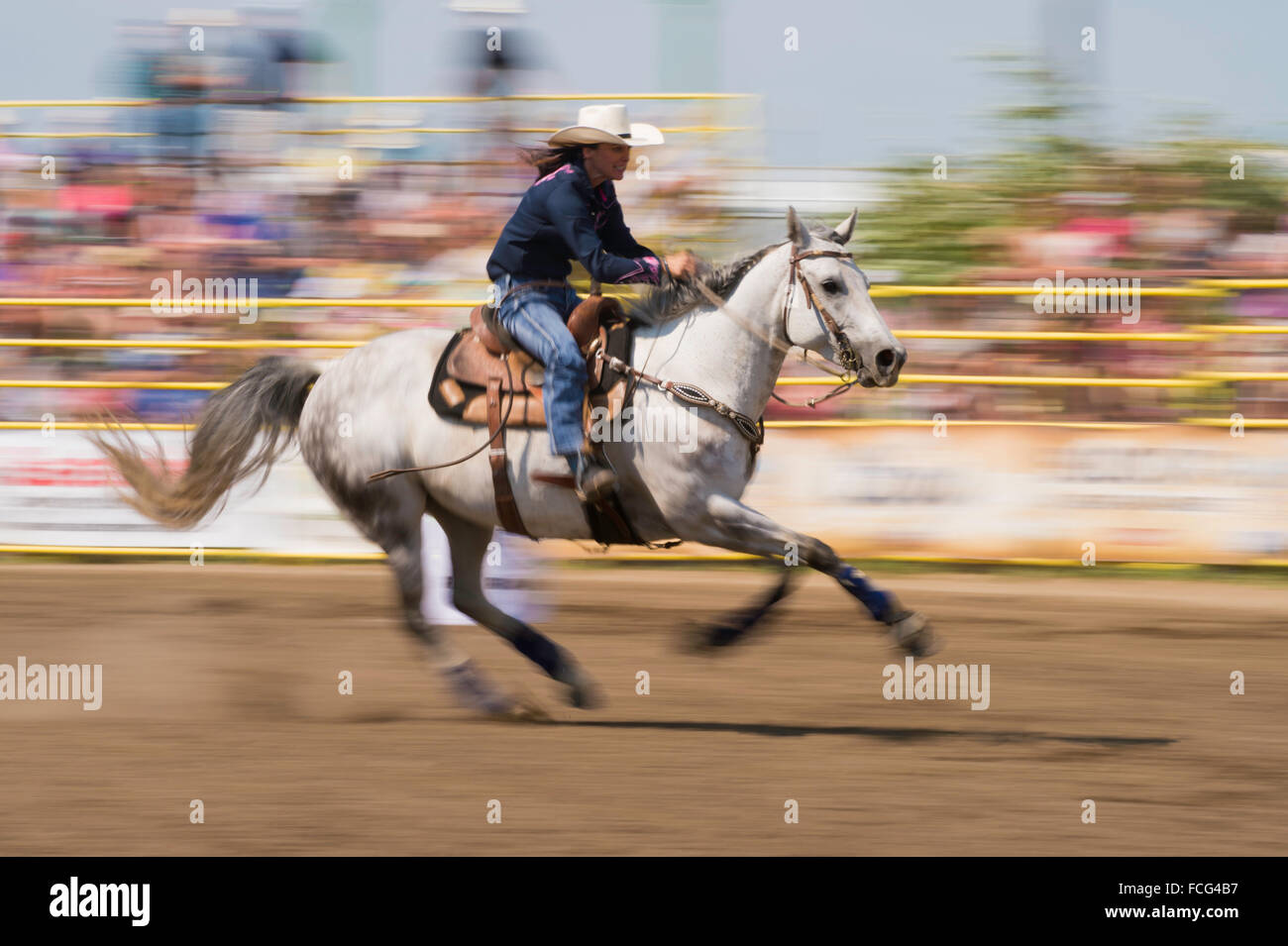 Motion blur of a cowgirl riding fast during barrel racing, Strathmore ...