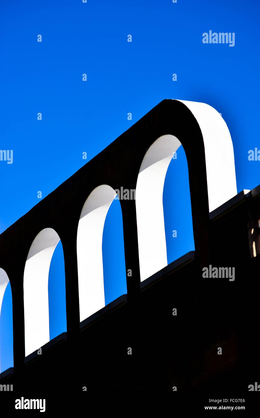 White arcs of a building against blue sky Stock Photo - Alamy