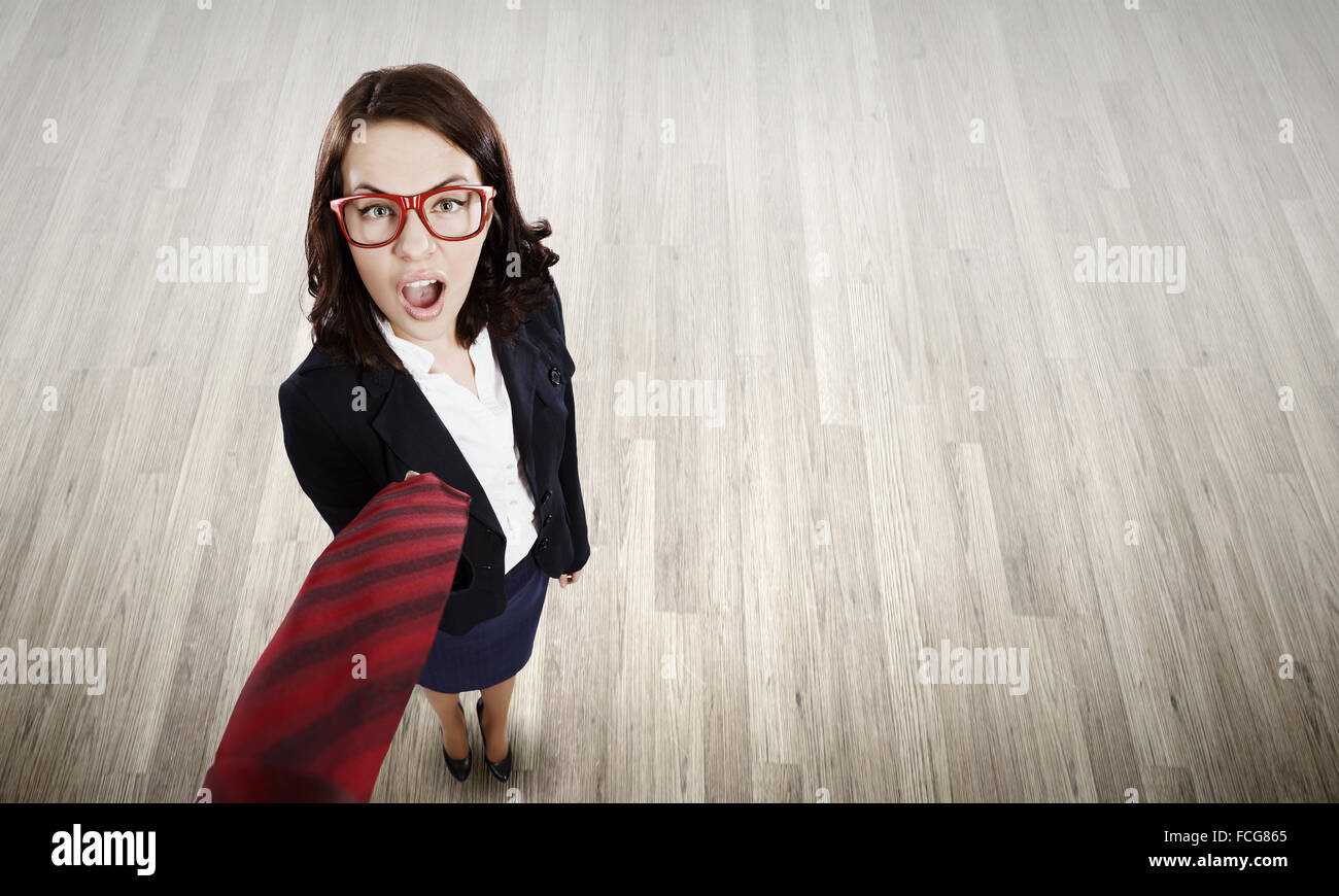 Top view of businesswoman pulling tie of boss Stock Photo - Alamy