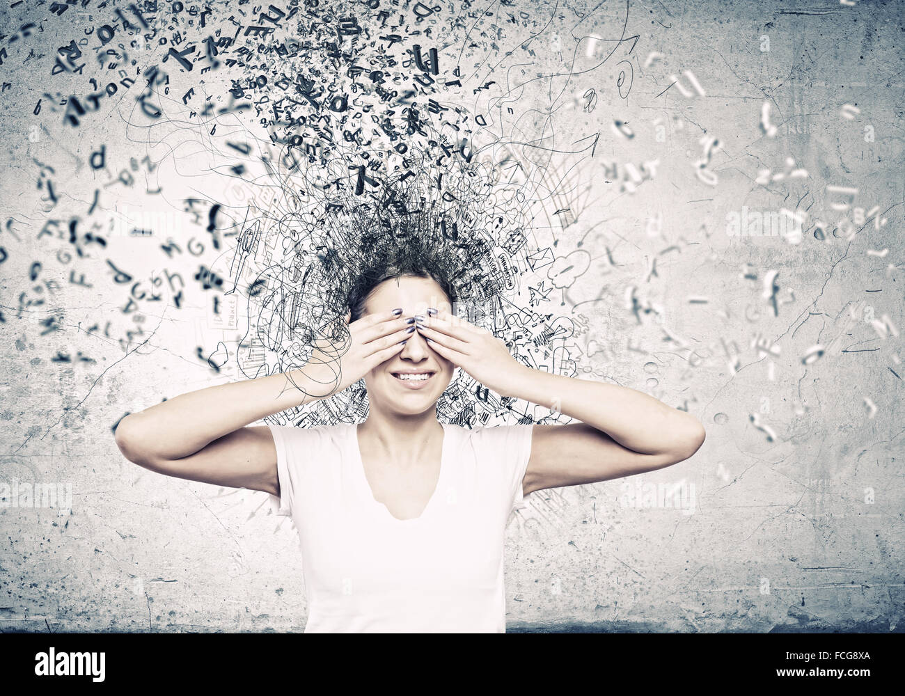 Young woman in casual hiding eyes behind palms Stock Photo - Alamy