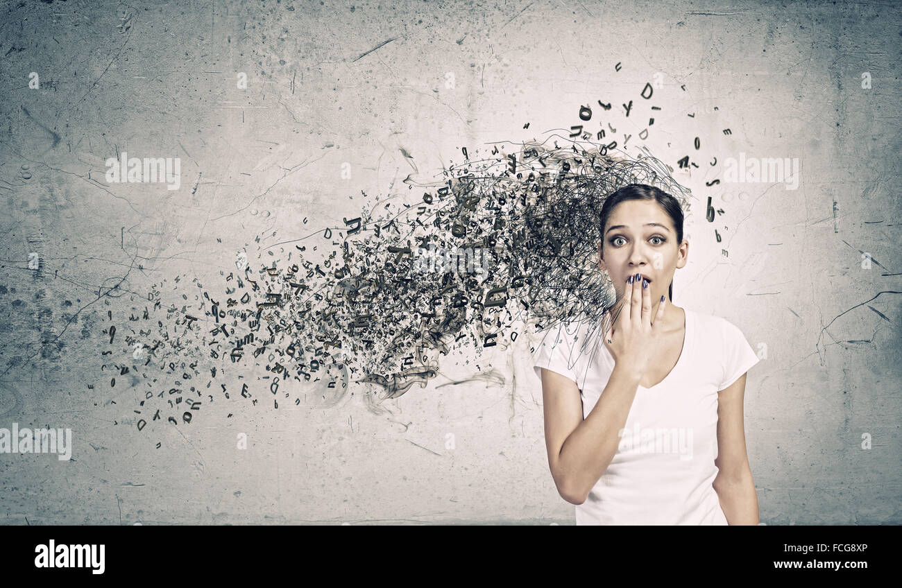 Young excited woman in casual closing mouth with palm Stock Photo - Alamy