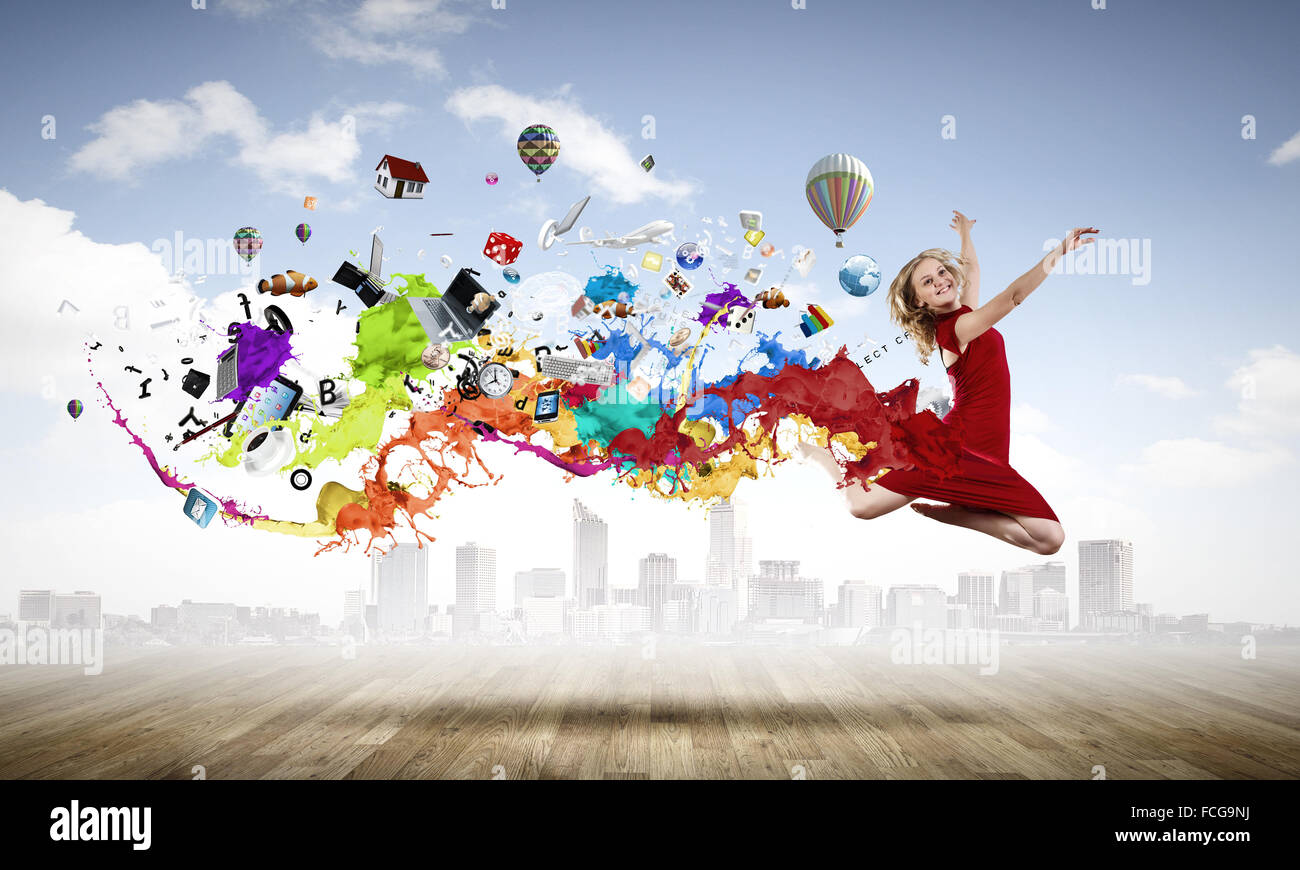 Young woman dancer in red dress jumping high Stock Photo - Alamy