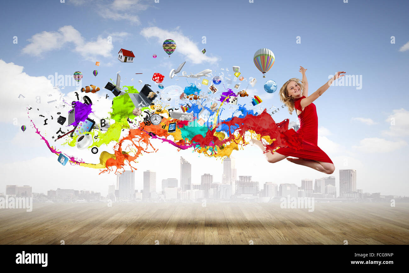 Young woman dancer in red dress jumping high Stock Photo - Alamy