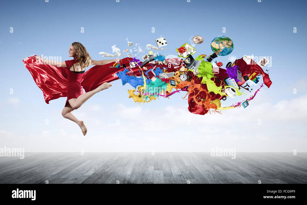 Young woman dancer in red dress jumping high Stock Photo - Alamy