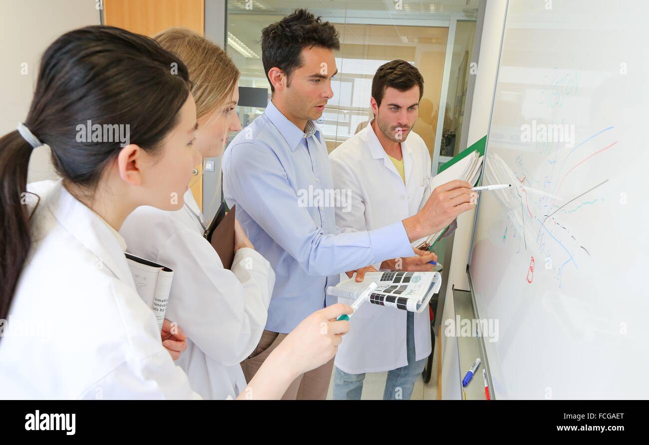 Asian researchers talking hi-res stock photography and images - Alamy
