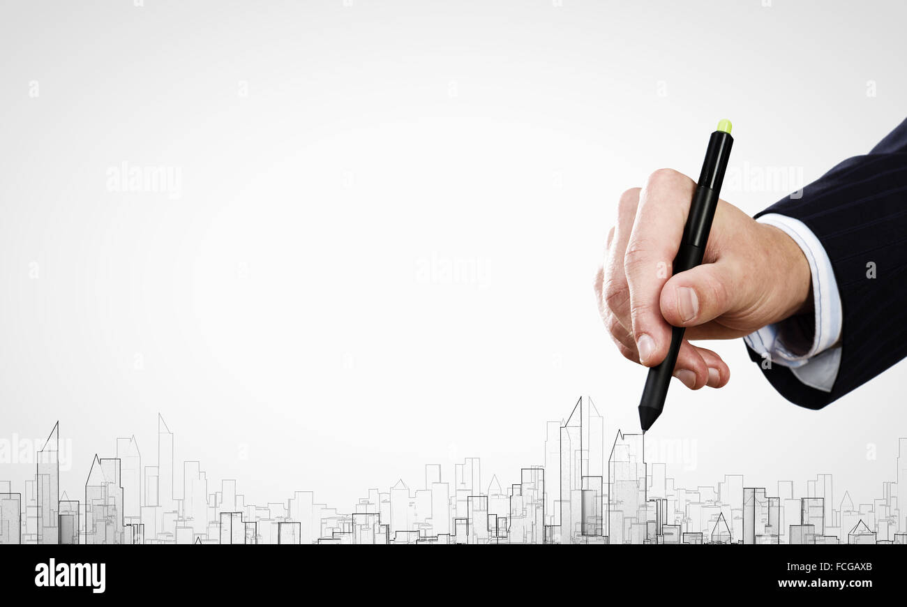 Close up of male hand drawing construction project Stock Photo - Alamy