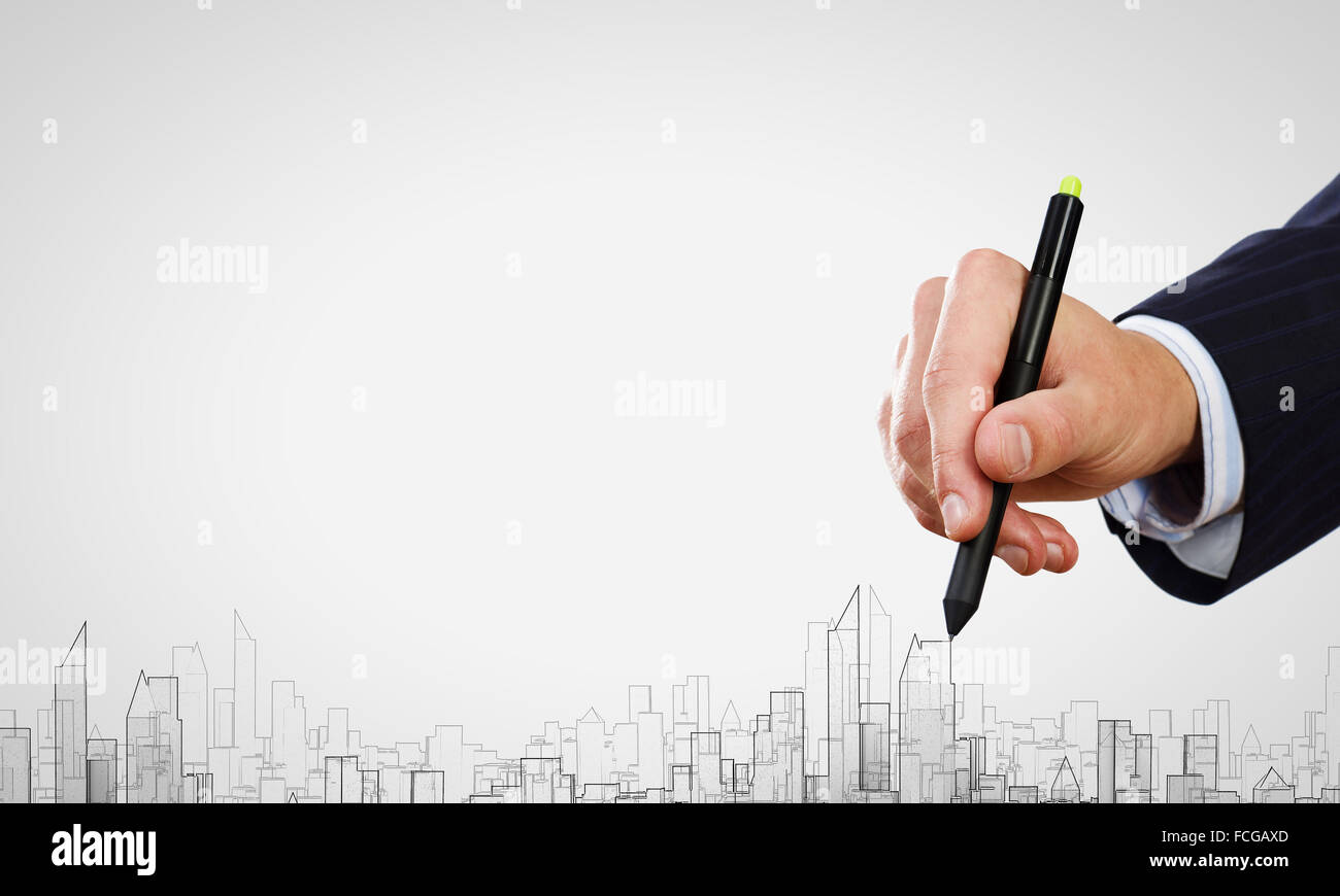 Close up of male hand drawing construction project Stock Photo - Alamy