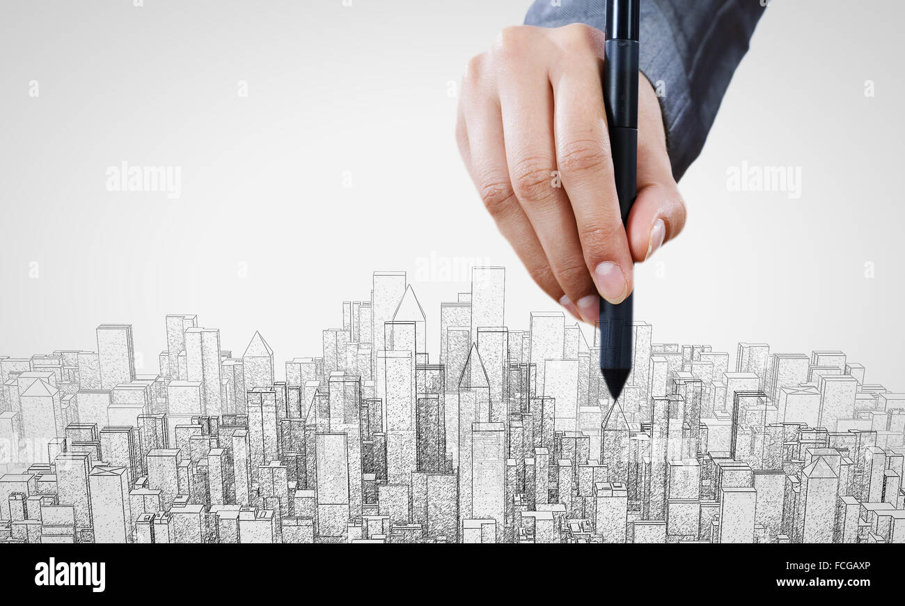 Close up of male hand drawing construction project Stock Photo - Alamy