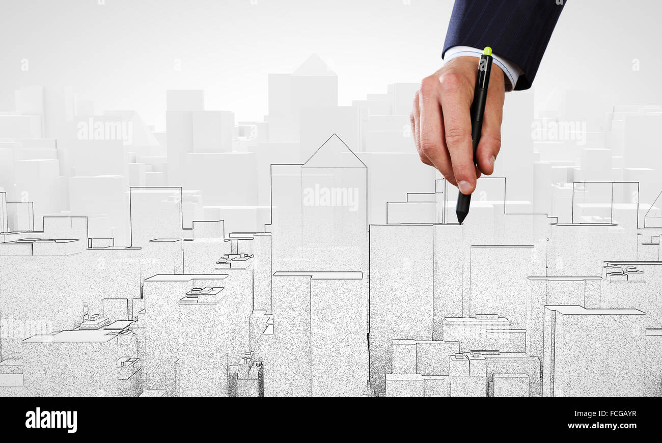 Close up of male hand drawing construction project Stock Photo - Alamy