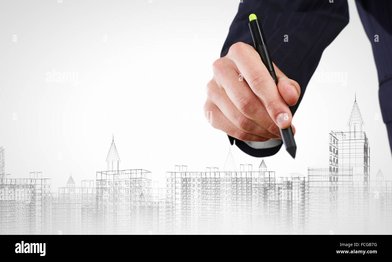 Close up of male hand drawing construction project Stock Photo - Alamy