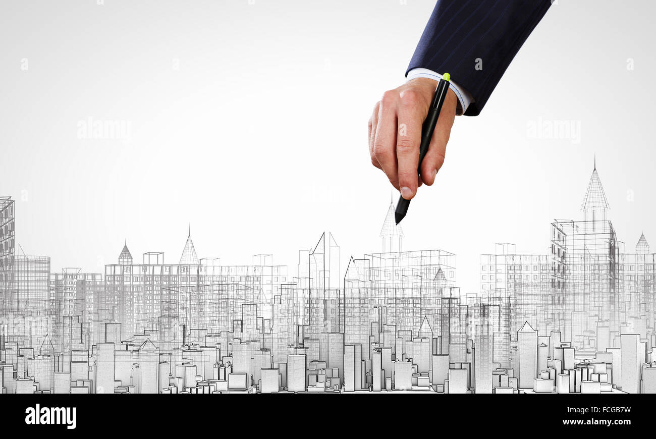 Close up of male hand drawing construction project Stock Photo - Alamy