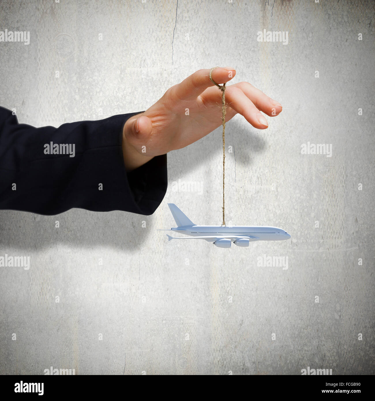 Close up of male hand holding airplane model on rope Stock Photo - Alamy