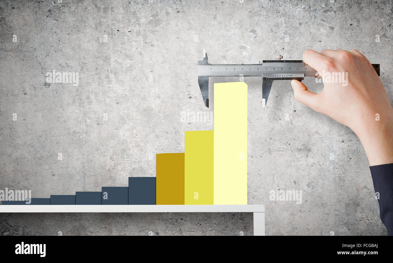 Close up of female hand measuring graph with ruler Stock Photo - Alamy