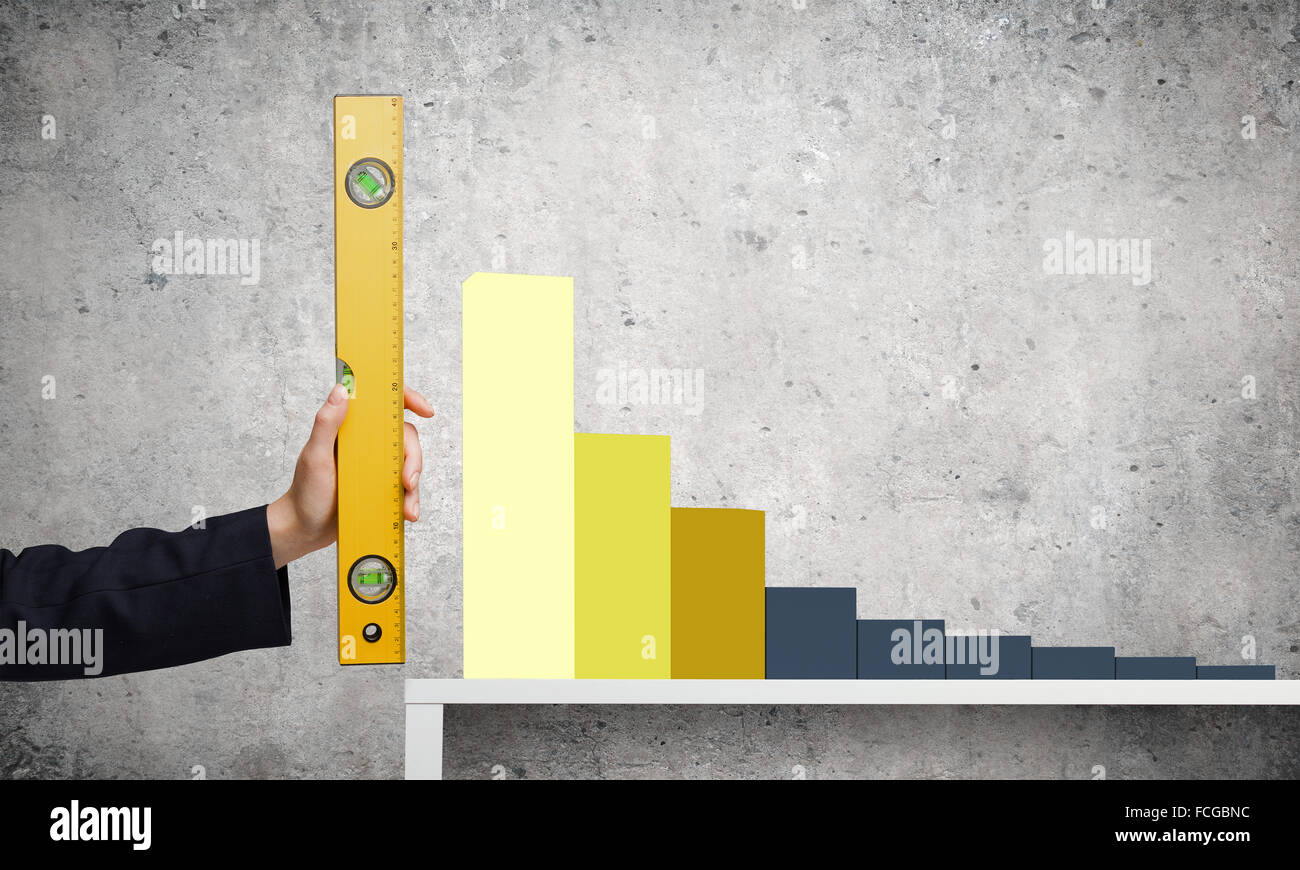 Close up of female hand measuring graph with ruler Stock Photo - Alamy